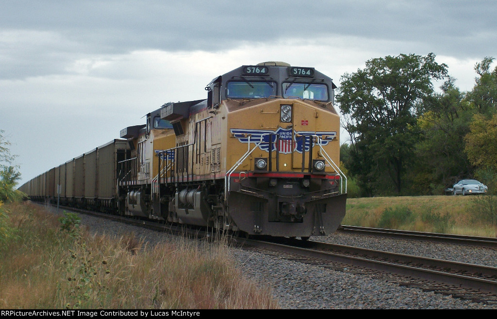 UP 5764 tied down eastbound UP loaded coal train
